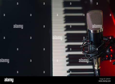 Synthesizer Midi Keyboard And Microphone On A Black Background Close