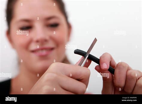 Female Cutting Wire Stock Photo Alamy