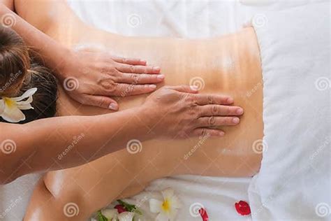 Asia Beautiful Woman During Massage With Essential Oil In Room Spa
