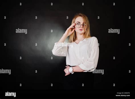 Studio Portrait Of Blonde Businesswoman In Glasses White Blouse And