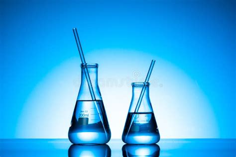 Two Conical Flasks With Glass Mixing Tubes At A Lab Stock Image Image Of Laboratory Liquid