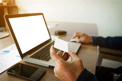 Premium Photo Man Holding Card In Hand And Entering Security Code