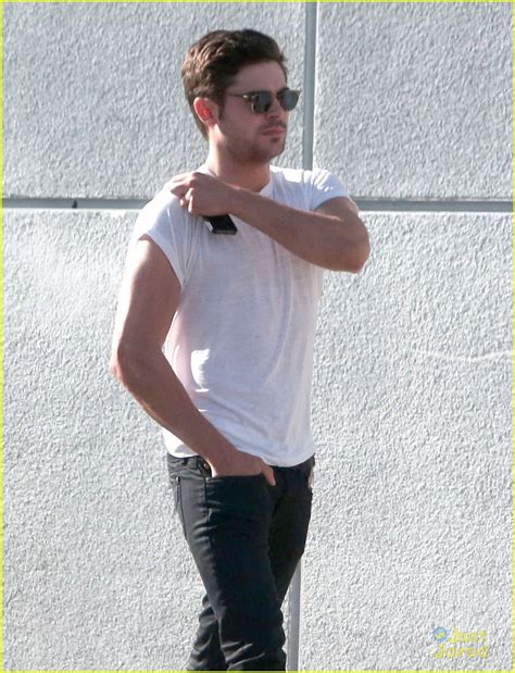 Zac Efron Wears Tight White Tee While Out With Barefoot Friend Photo