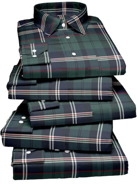 Premium Photo A Stack Of Green Plaid Shirts With The Word Plaid On Them