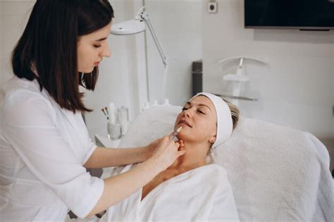 Premium Photo Woman Having Lip Injections A Prick Of A Syringe For The Beauty Lips Lip