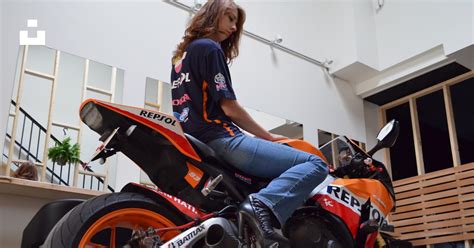 Man Riding On Orange And Black Repsol Sports Bike Photo Free Human