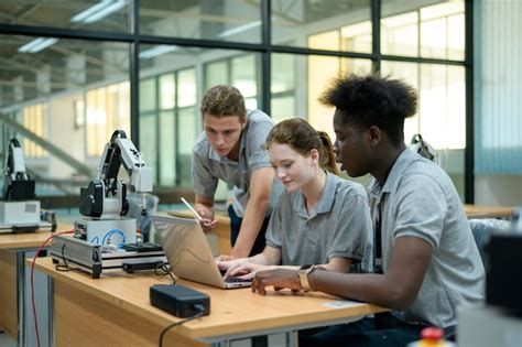 Premium Photo Trainee Robotics Engineer Learning With Programming And