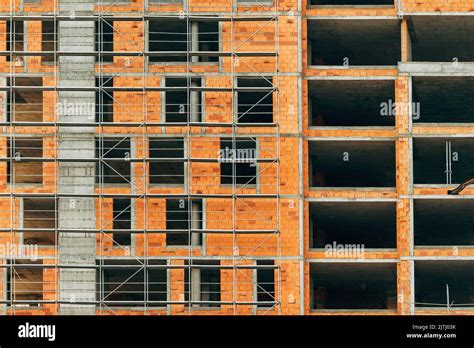 Construction Industry And Apartment Building Development Scaffolding Surrounding Tall Built