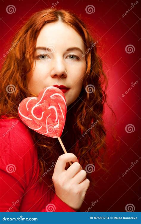 Woman with Heart Caramel Over Red Background Stock Photo - Image of ...