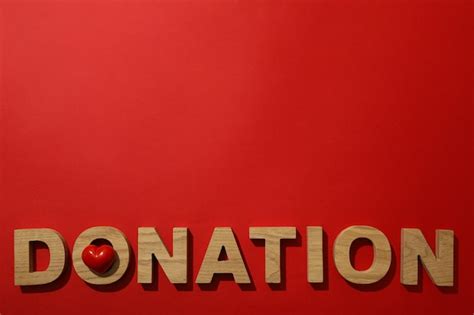 Premium Photo The Word Donation On A Red Background