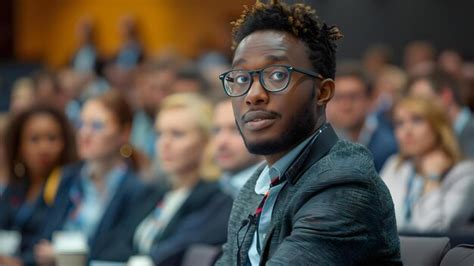 Engaging Qa Session At Technical Conference Featuring Young Expert