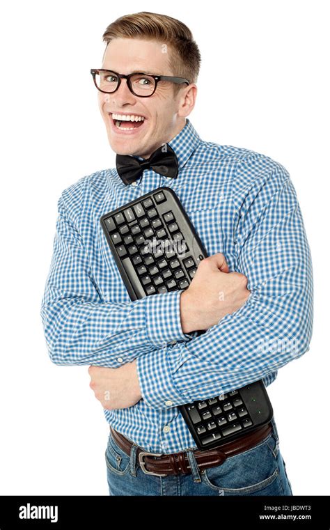 Cheerful Nerd Guy Holding Keyboard Tightly Stock Photo Alamy