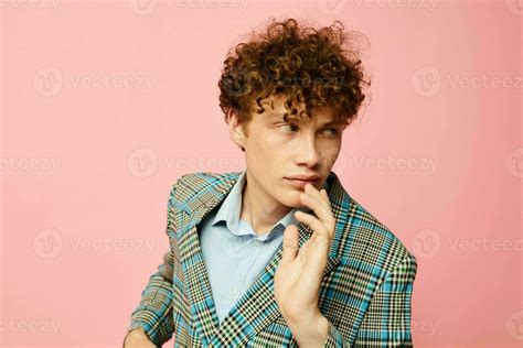 Portrait Of A Young Curly Man In A Suit Business Look Posing Emotions