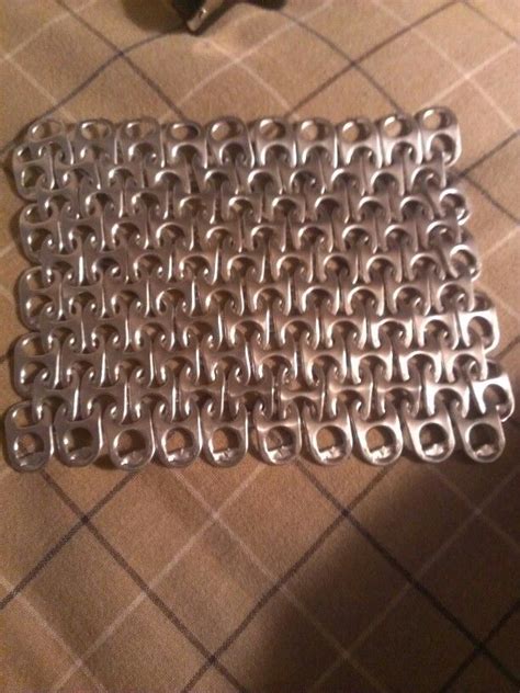 Block Of 100 Pop Tabs When Bent In Half With A Staple Remover And Cut At The Top With Scissors
