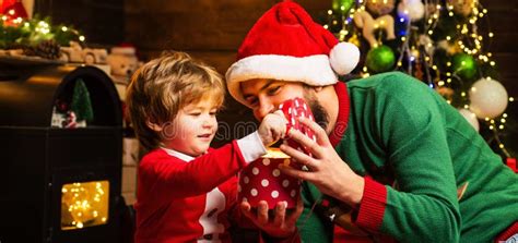 Daddy And Son Open Christmas Gift Father And Son Wish You Merry Christmas Stock Image Image