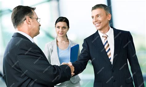 Premium Photo Business People Handshaking At Meeting On Background