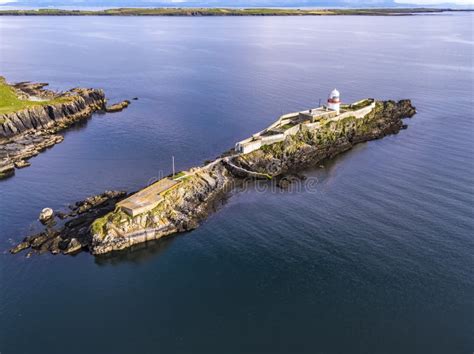 Aerial Of The Rotten Island Lighthouse With Killybegs In Background
