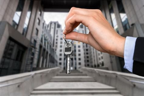 Premium Photo Hands With Keys Handing Over The Keys