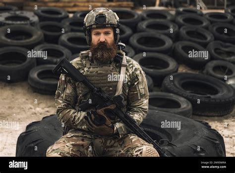 Bearded Soldier In Military Uniform Looking Determined And Serious