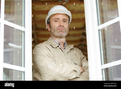 A Male Builder During Window Installation Process Stock Photo Alamy