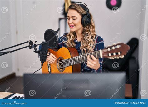 Young Woman Musician Singing Song Playing Classical Guitar At Music