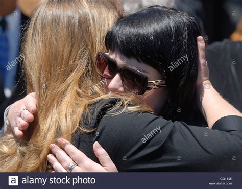 Meta Mitchell Daughter Of The Late Jim Mitchell Gets A Hug From A