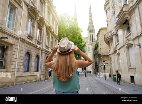 Tourism In France Back View Of Traveler Girl Visiting The City Of