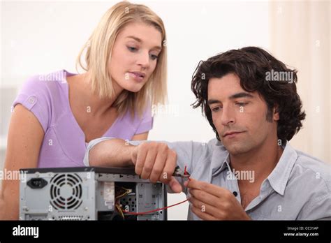Man Cutting A Wire Stock Photo Alamy