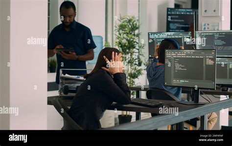 Asian System Engineer Trying To Find Html Script And Code To Program Cloud Computing App Using