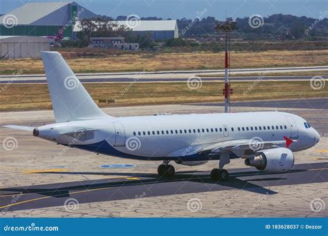 Side View Of A Passenger Plane While Taxiing To Runway Stock Image