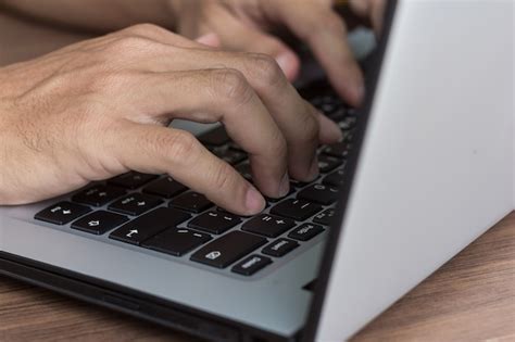 Premium Photo Man Hands Using Laptop Computer