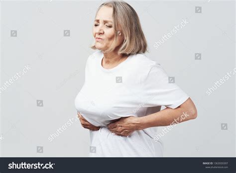 Photo De Stock Elderly Woman Touches Her Breasts Her 1363939397