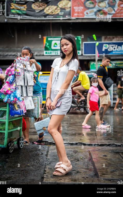 A Beautiful Young Filipino Girl Poses In The Binondo District Of Manila
