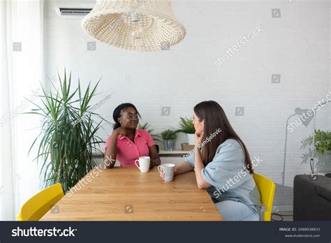 Two Friends Having Coffee Over 9950 Royalty Free Licensable Stock