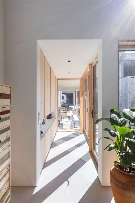 fem architects covers dutch row house in weathering steel facade