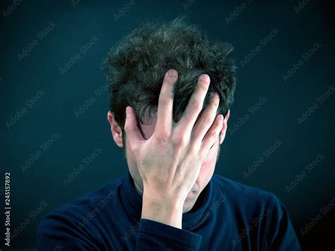 desperate man cover his face. Young stressed caucasian person covers ...