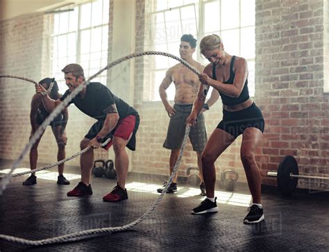Fit Young People Doing Crossfit Training In The Gym People Doing
