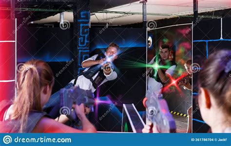 Girls And Guys Playing Laser Tag Game Opposite Each Other In Da Stock Photo Image Of