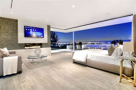 Luxury Bedroom With Fireplace And Large Bed Luxury Bedroom With Patio