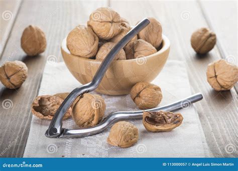 Cracking And Shelling Walnuts Stock Image Image Of Shelling Nutcracker 113000057