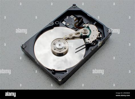 Closeup Of An Open HDD Revealing Its Gears And Internal Circuitry Technological And Innovation