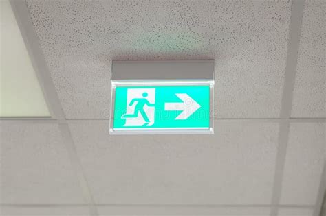 Glowing Exit Sign On The Ceiling In The Corridor Stock Photo Image Of Green Icon 328237506