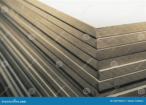 A Stack Of Mdf Panels Neatly Stacked In A Cabinetry Shop Background