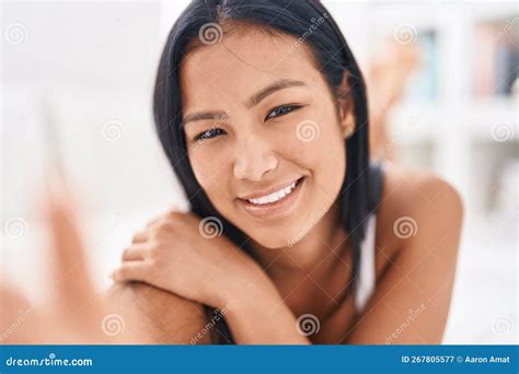 Young Beautiful Latin Woman Wearing Lingerie Make Selfie By Camera At