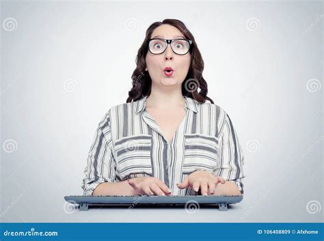 Funny Girl Programmer In Glasses With Keyboard In Front Of Computer