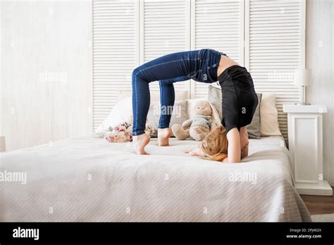 Young Girl Doing Gymnastics Over White Background Girl Makes A