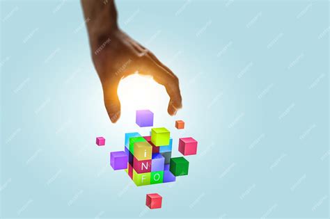 Premium Photo Man`s Hand And A Bunch Of Colourful Cubes Levitating Above Mixed Media