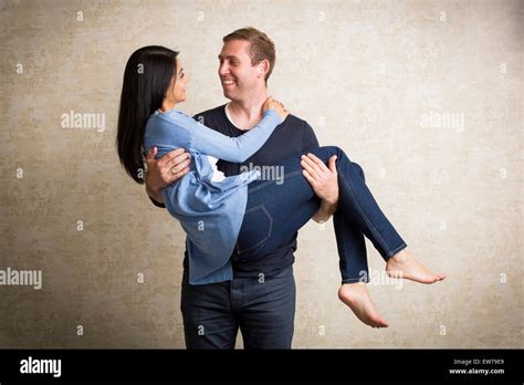 Man Carrying Woman In His Arms Stock Photo 84368993 Alamy