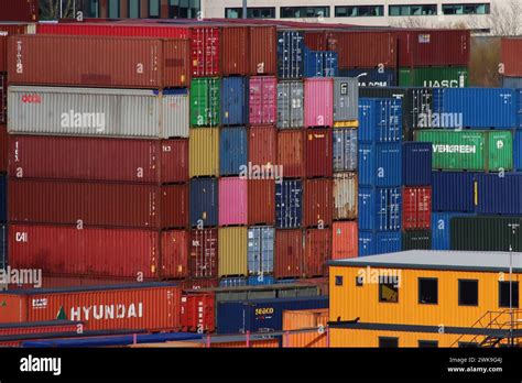 Container City A Tall Stack Of Multiple Shipping Containers Dwarfs A