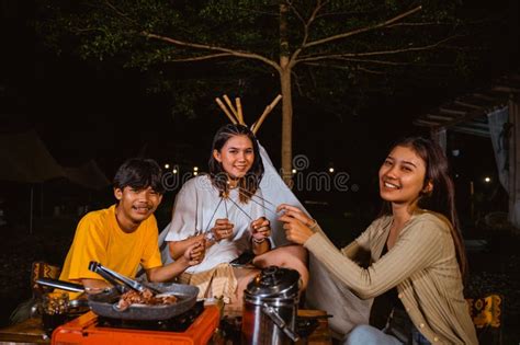 Three Adults Playing The Fireworks Together Stock Image Image Of